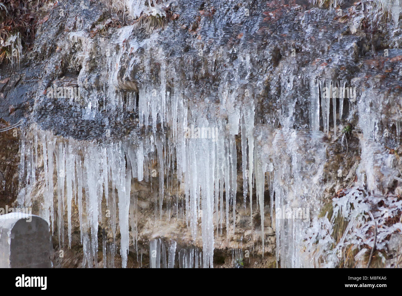 Ice Stalactite on Rock Stock Photo - Alamy