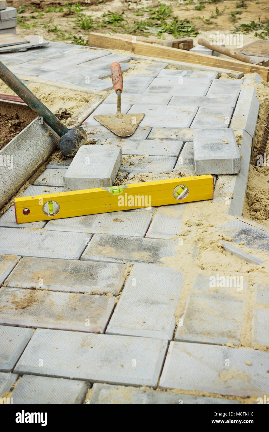 Path of concrete сobbles in the process of construction Stock Photo - Alamy