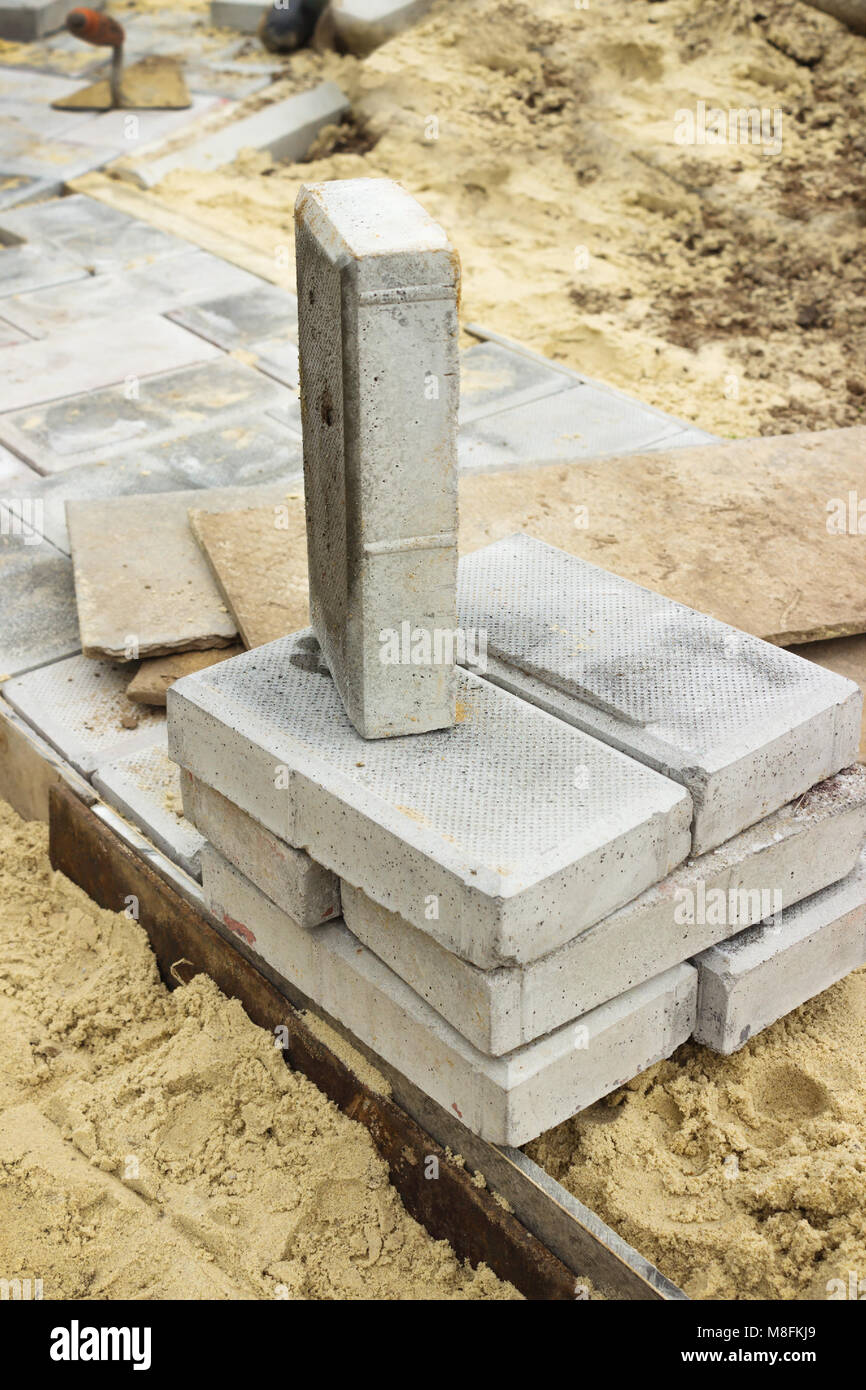 Path of concrete cobblestone in process of construction Stock Photo - Alamy