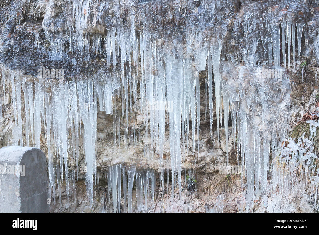 Ice Stalactite on Rock Stock Photo - Alamy