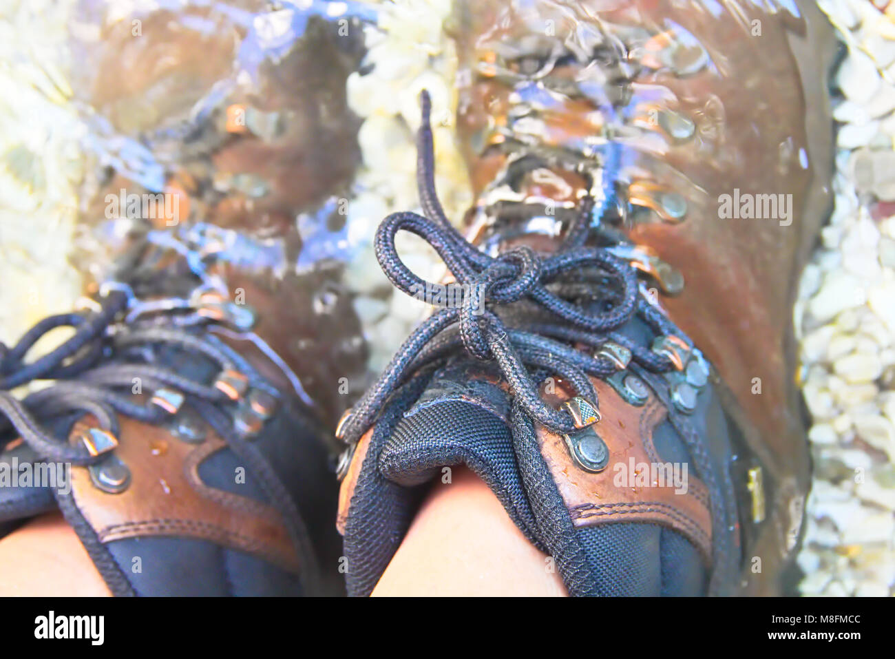 Young Woman Walking on the River with Hiking Boots Stock Photo - Alamy