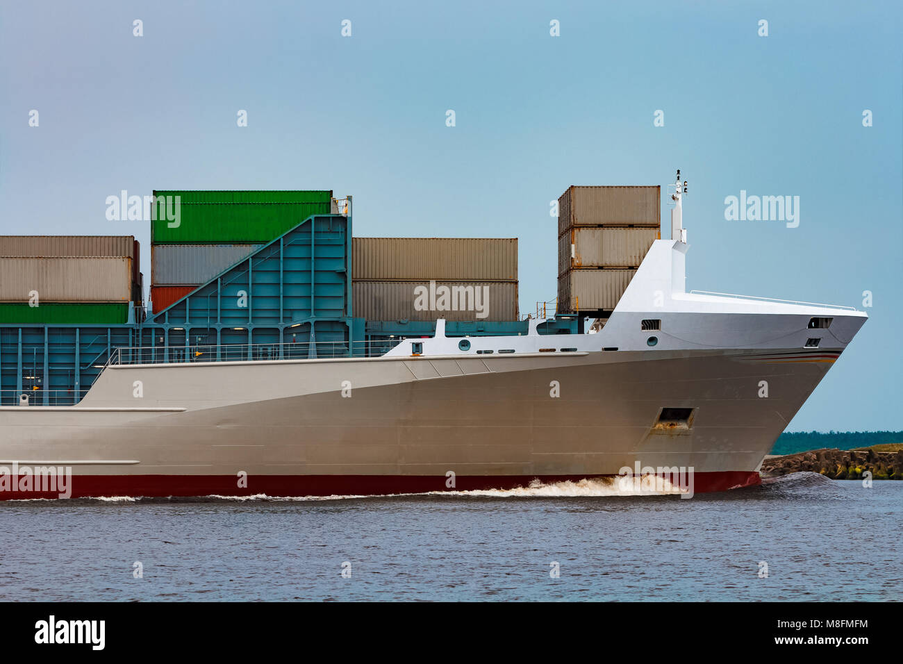 Grey container ship. Logistics and production import Stock Photo - Alamy