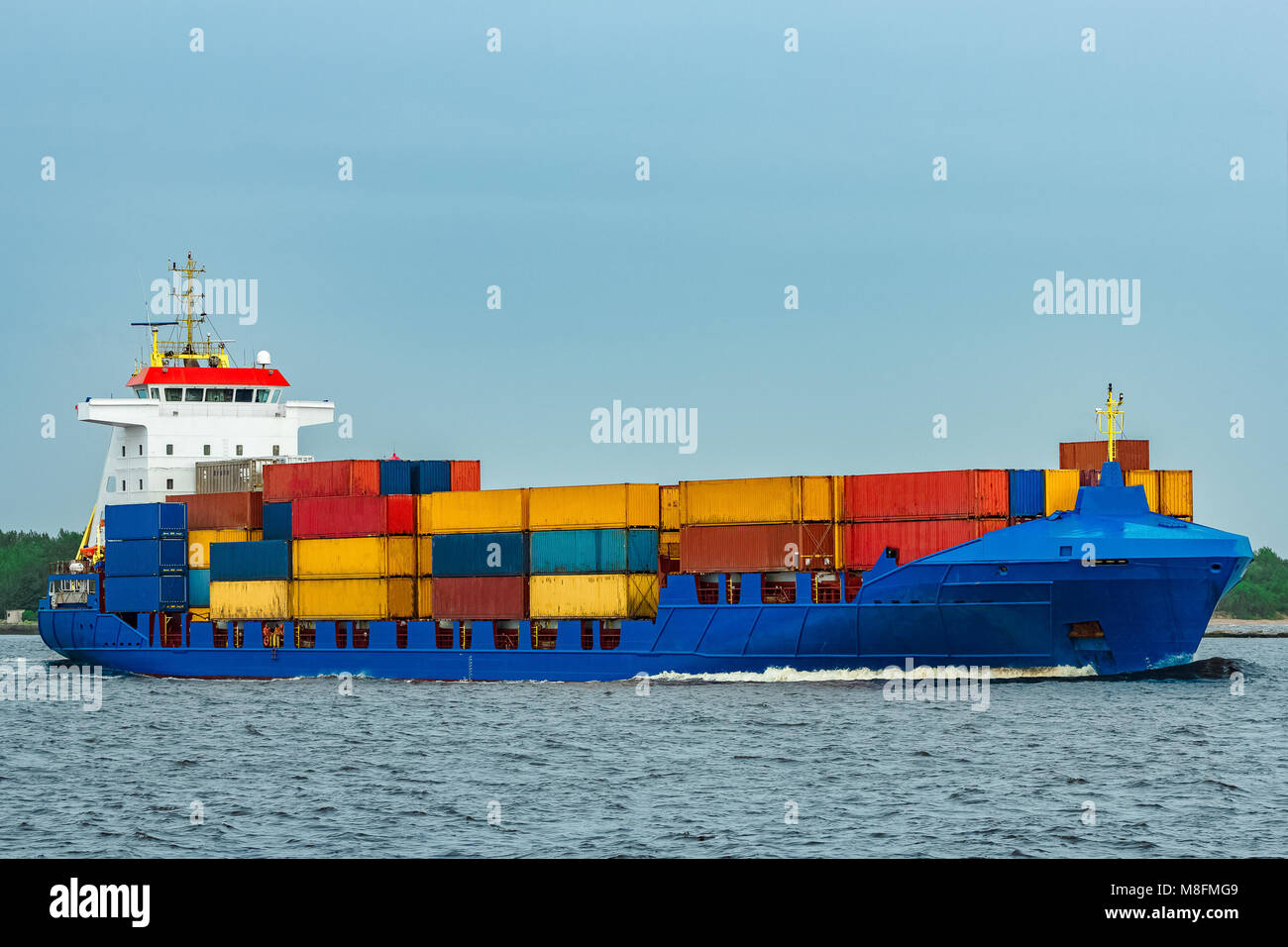 Blue cargo container ship fully loaded underway Stock Photo - Alamy