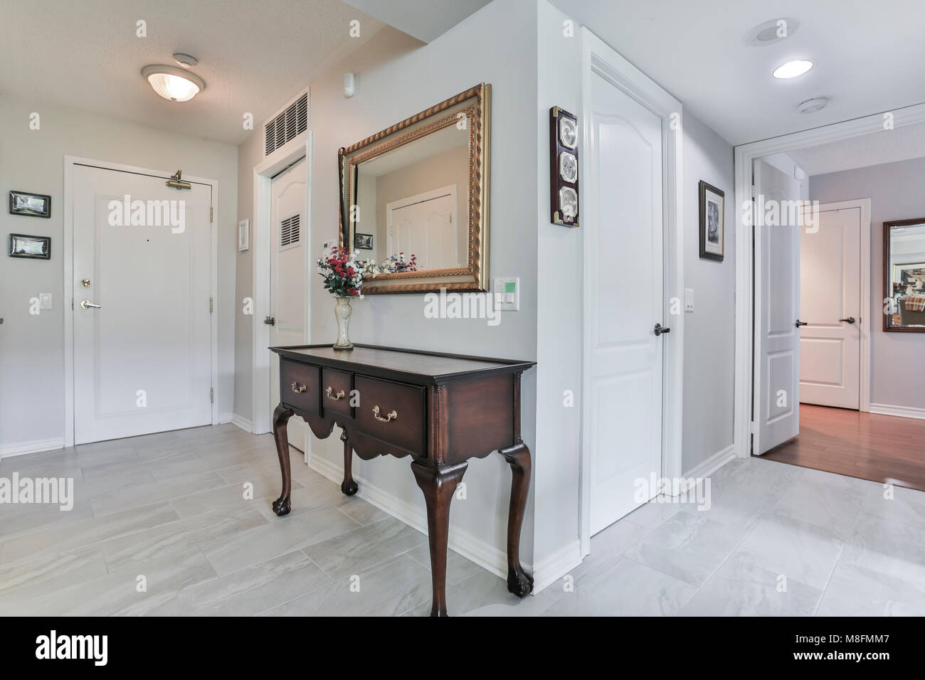 Front door with entrance hall of house Stock Photo - Alamy