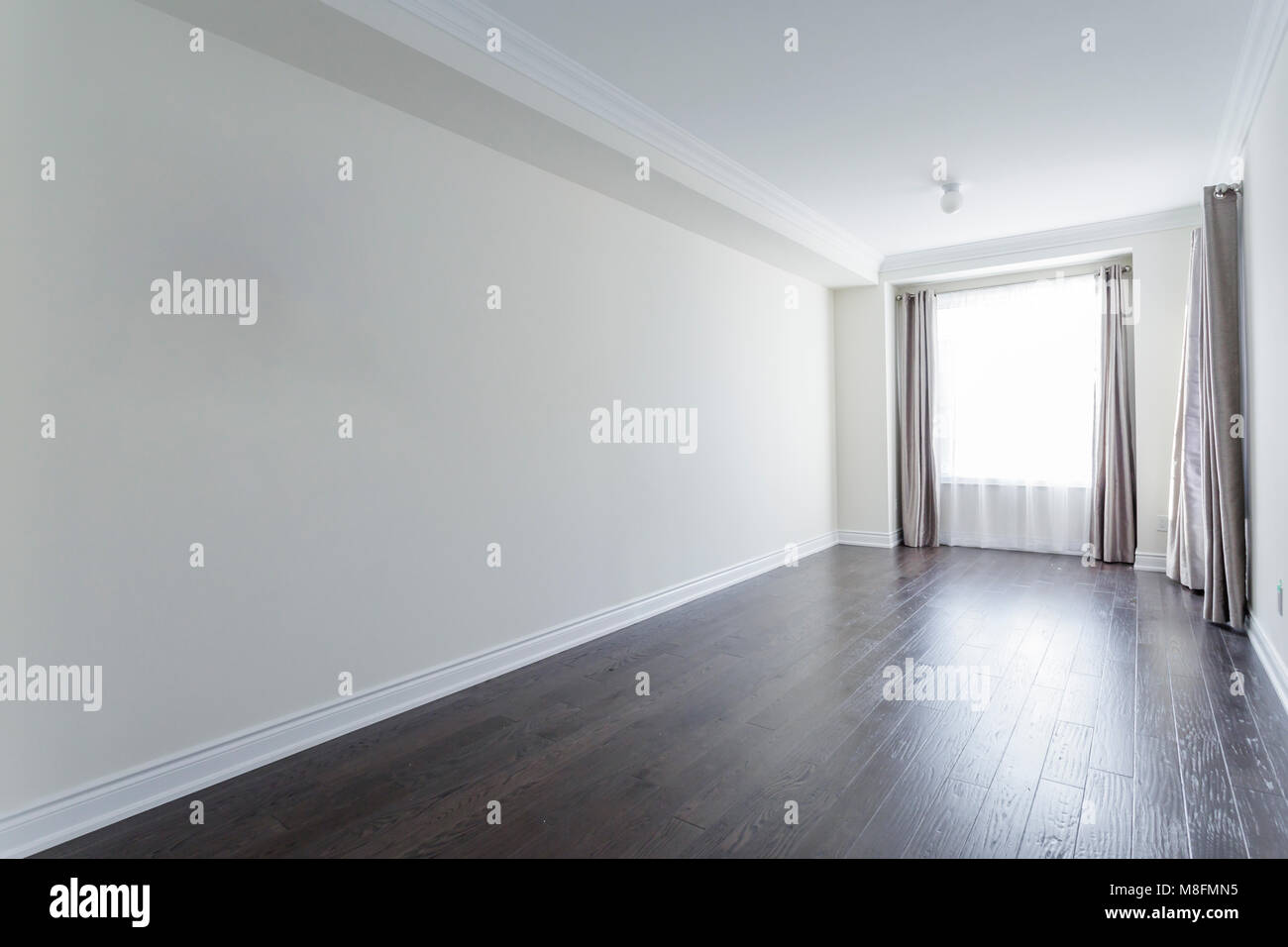 Empty living room interior design in a new house Stock Photo - Alamy