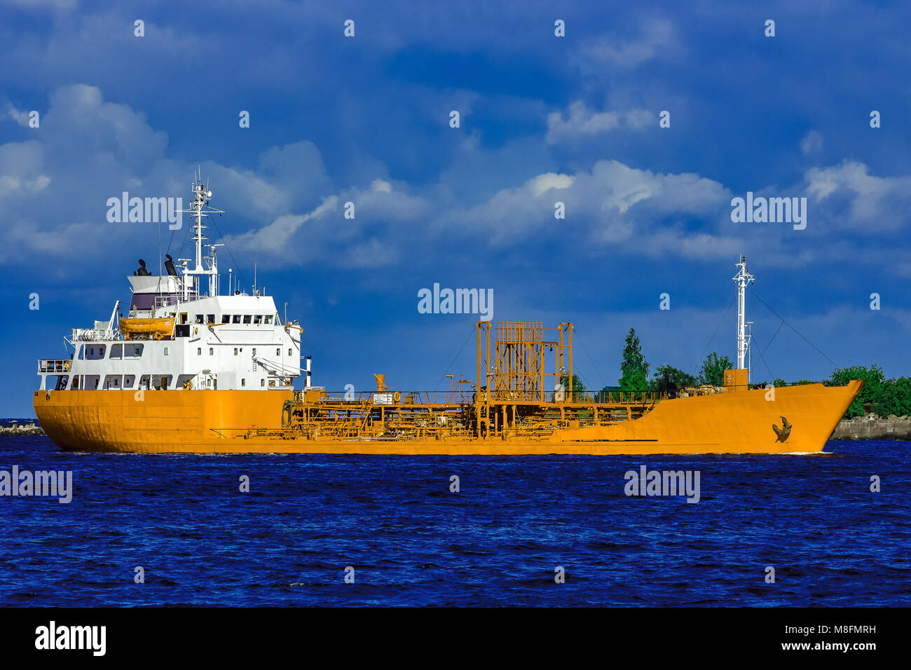 Yellow cargo tanker ship moving at the clear summer day Stock Photo - Alamy