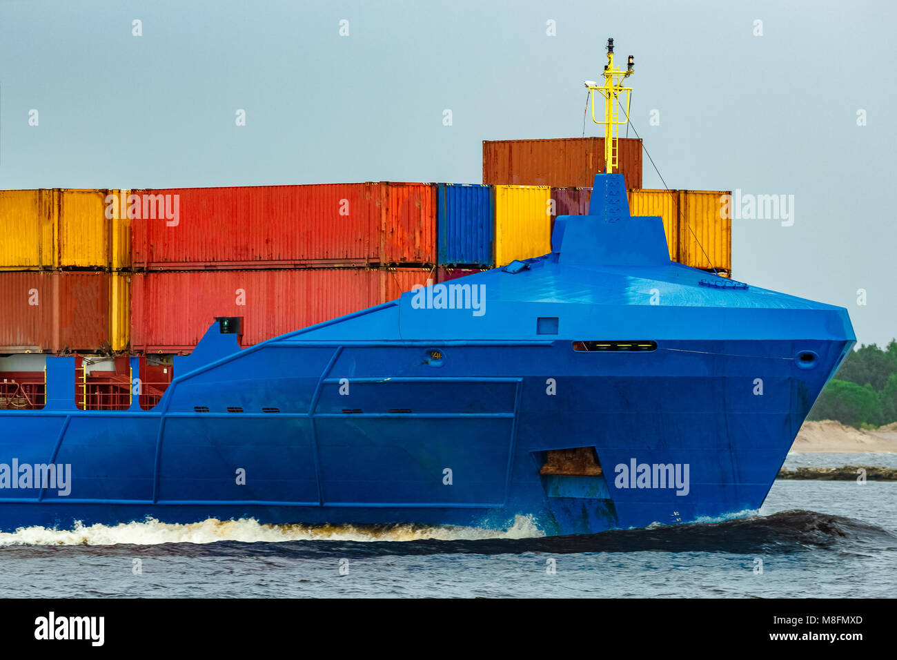 Blue cargo container ship fully loaded underway Stock Photo - Alamy