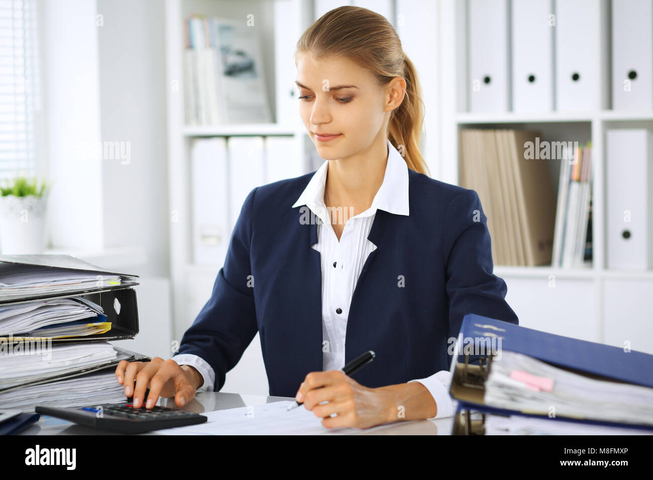 Modern business woman or confident female accountant in office. Student ...