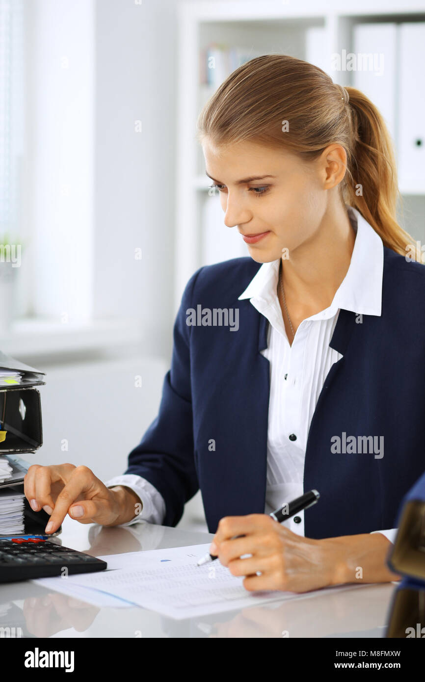 Modern business woman or confident female accountant in office. Student ...