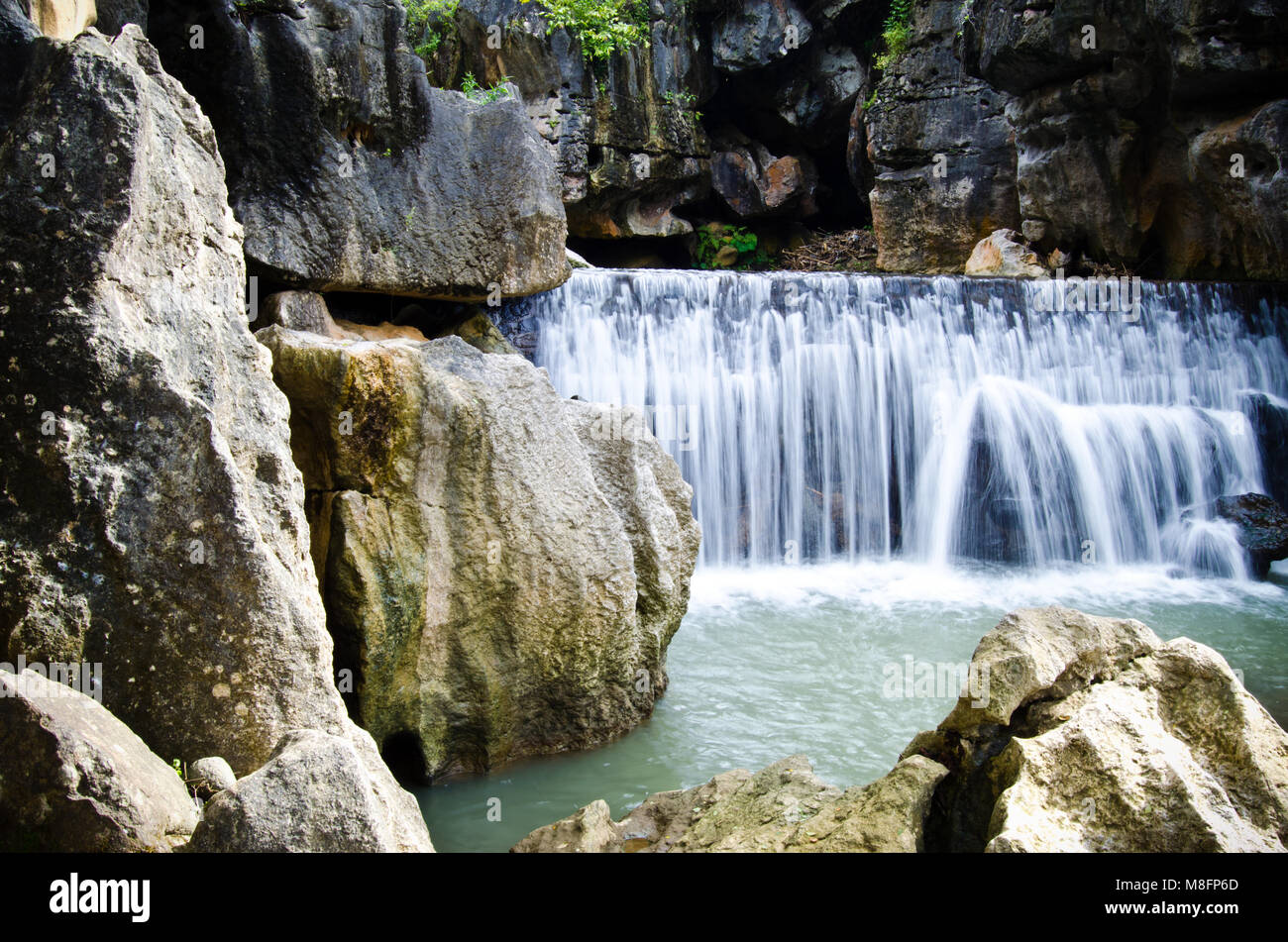 Aquatic waterfall in stone cliffs Stock Photo - Alamy
