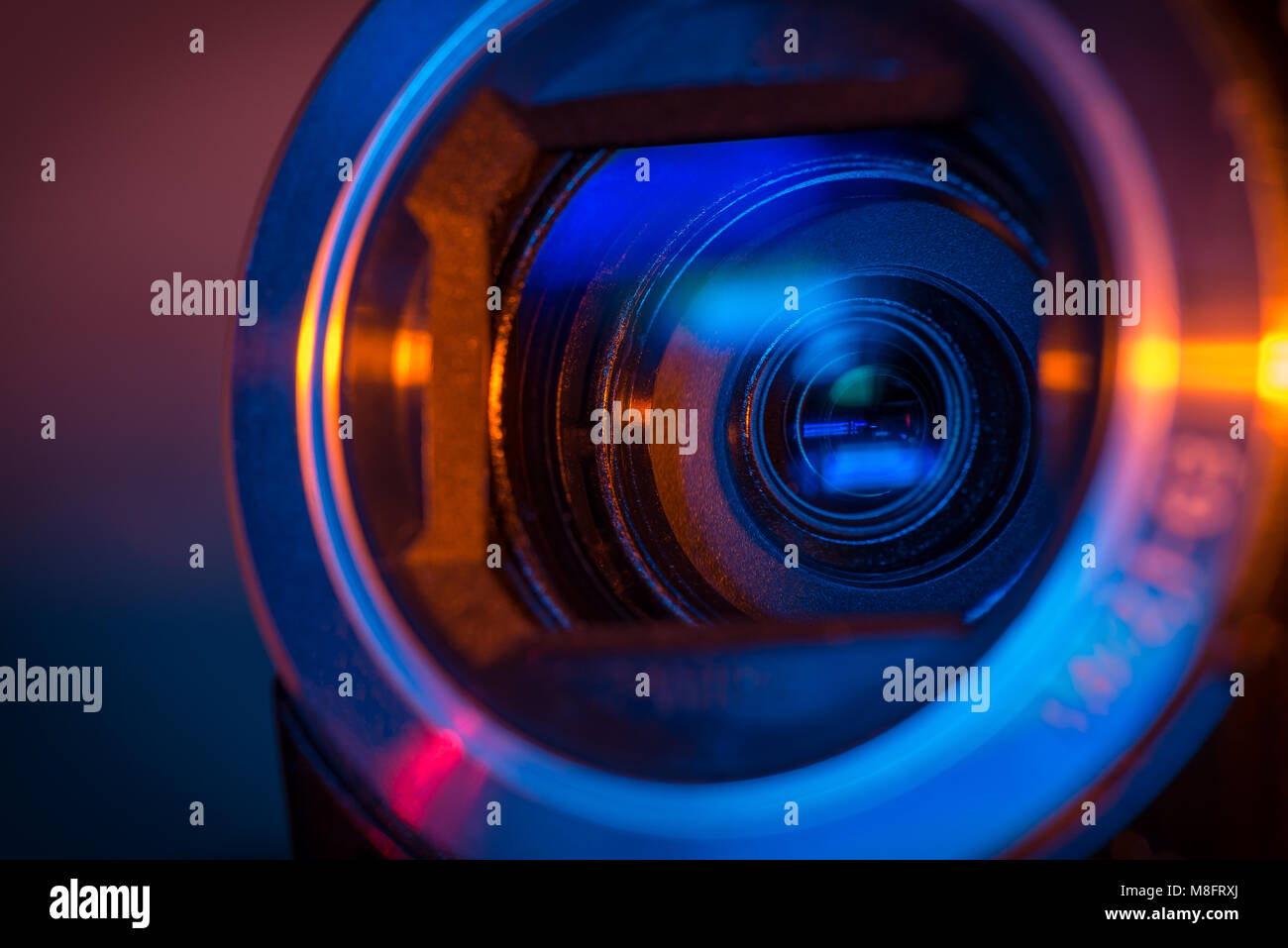 Video camera lens lit by different color light sources Stock Photo - Alamy