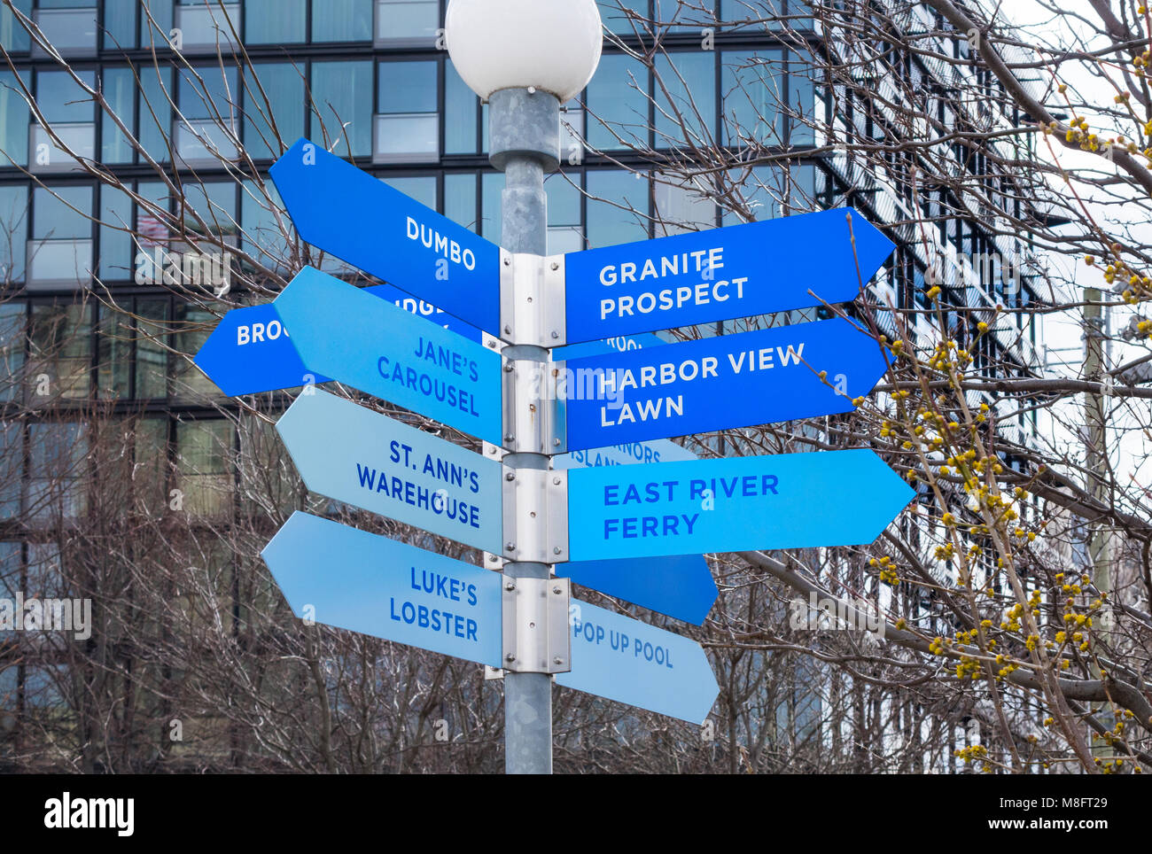 Direction signs near the Dumbo NYC Ferry Dock in Brooklyn Stock Photo ...
