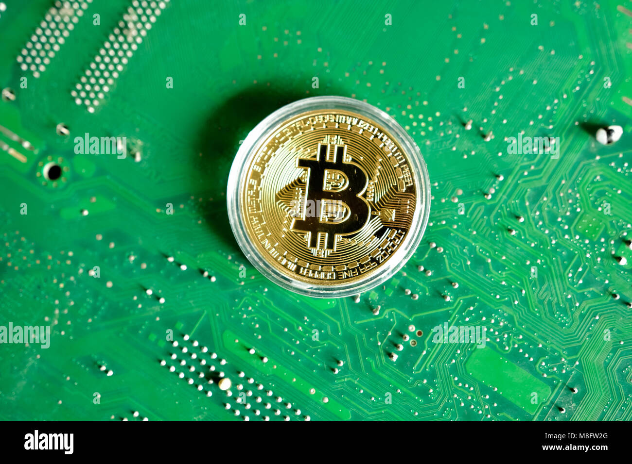 Bitcoin on computer motherboard circuit background Stock Photo - Alamy