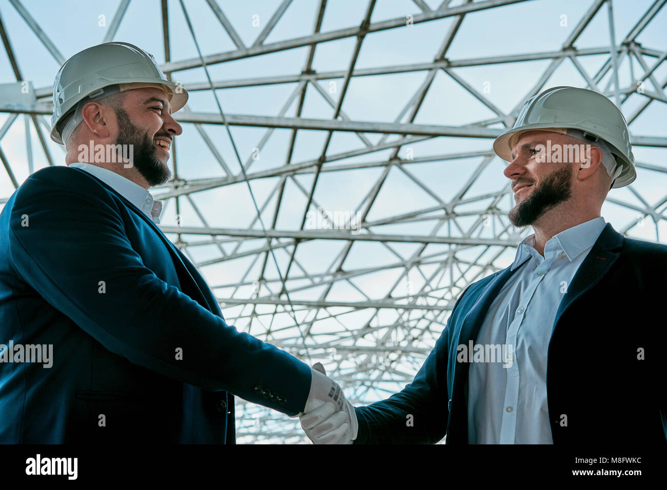 Construction teamwork handshake hi-res stock photography and images - Alamy