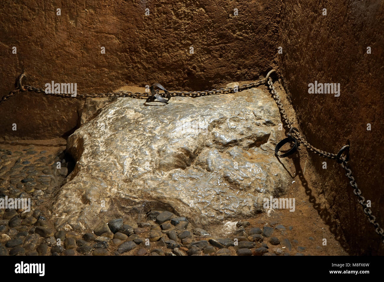 Chain in the cell of old prison Stock Photo - Alamy