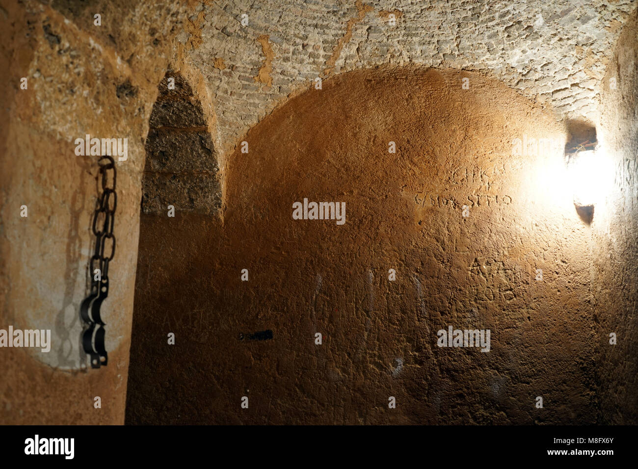 Chain in the cell of old prison Stock Photo - Alamy