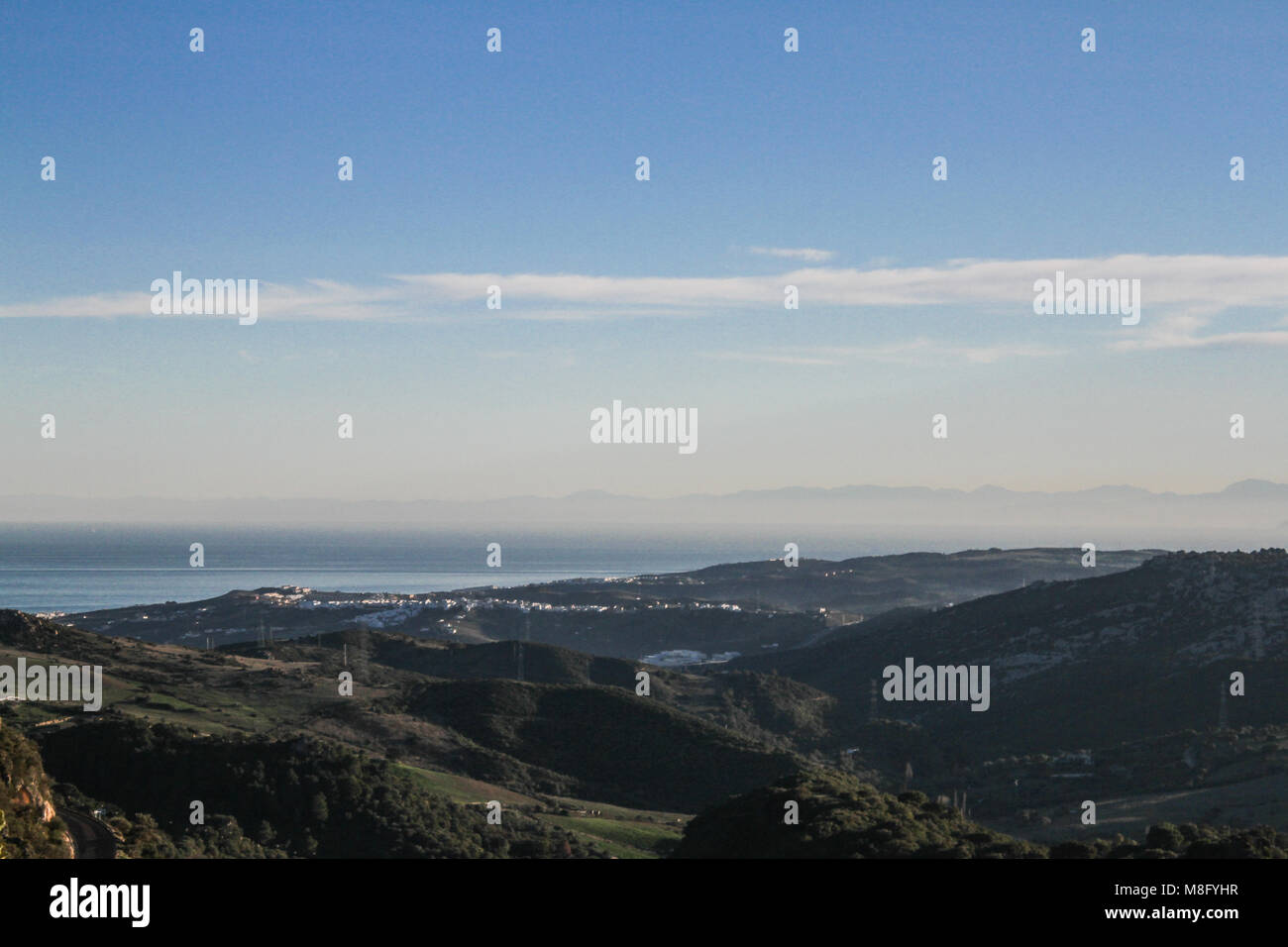Natural mountain scenery with windmills generating electricity Stock ...