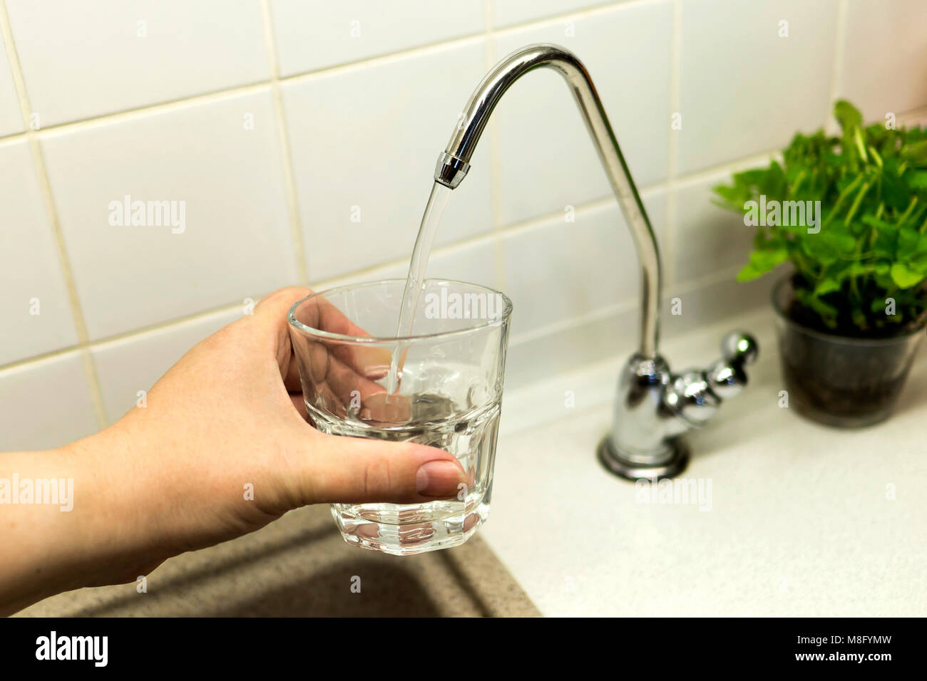 Clear transparent cold water flows from the tap Stock Photo - Alamy