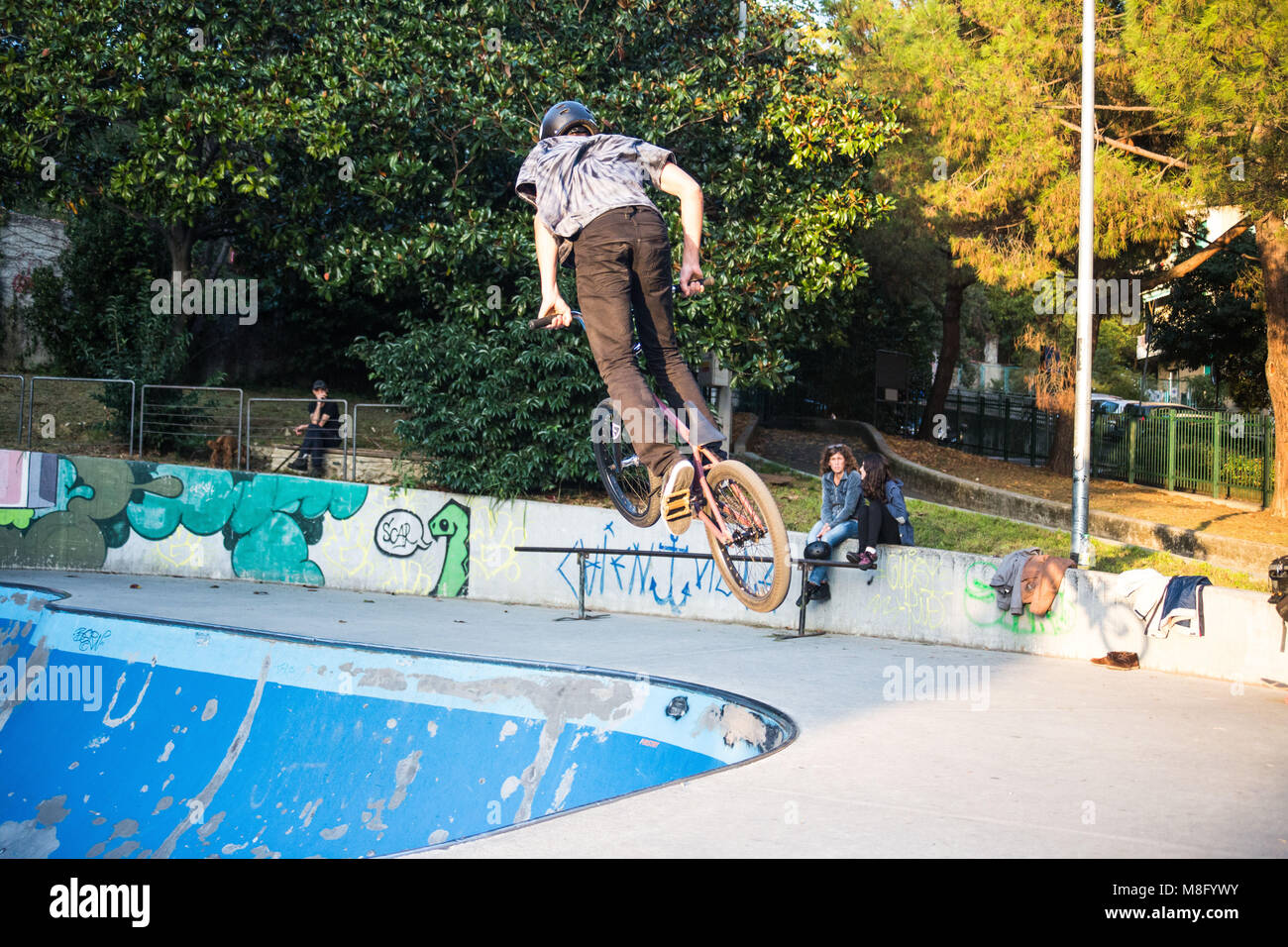 GENOA, ITALY NOVEMBER 16, 2015 - Boy jumping with BMX bike on a BMX ...