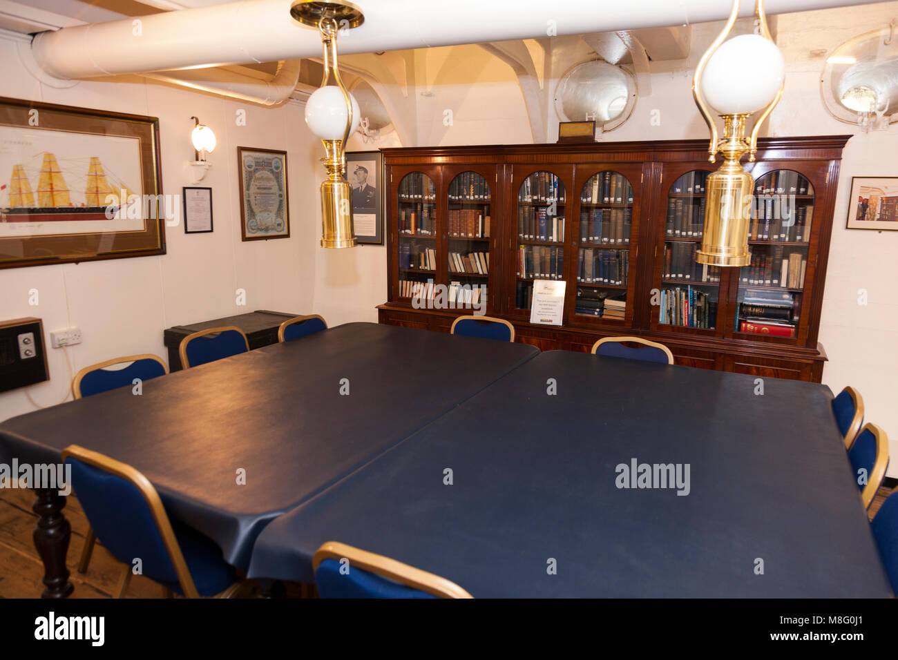 Room on board HMS Warrior set out with a table for meetings. On the ...