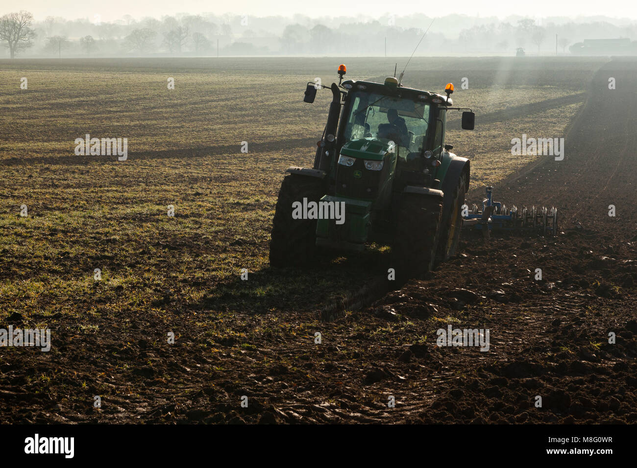 Tractor ploughing furrow hi-res stock photography and images - Alamy