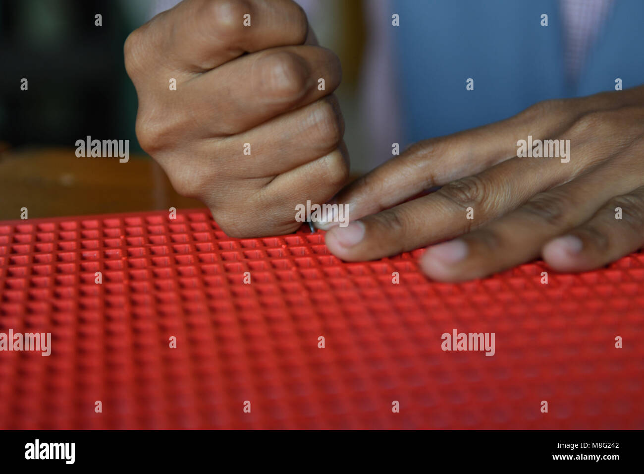 Agartala, India. 14th Mar, 2018. Indian blind girls are writing in a ...