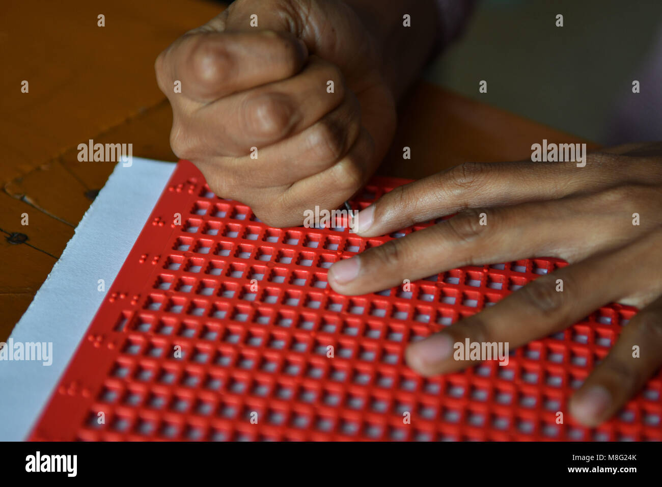 Agartala, India. 14th Mar, 2018. Indian blind girls are writing in a ...