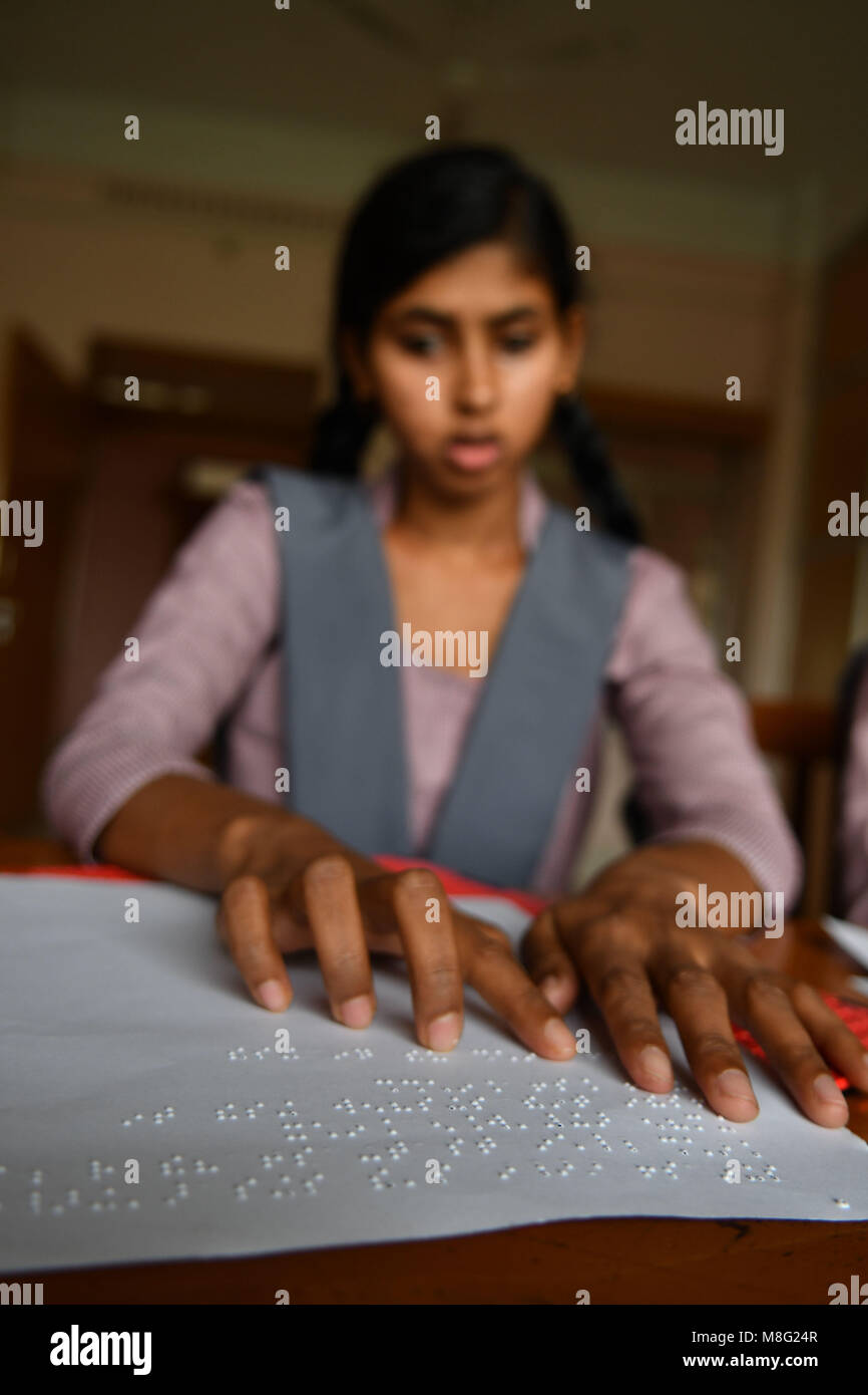 Agartala, India. 14th Mar, 2018. Indian blind girls are writing in a ...