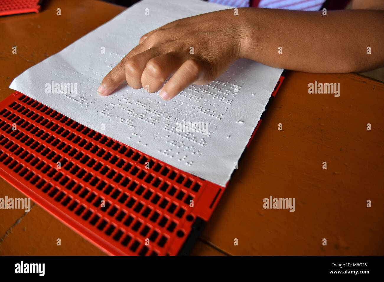 Agartala, India. 14th Mar, 2018. Indian blind girls are writing in a ...