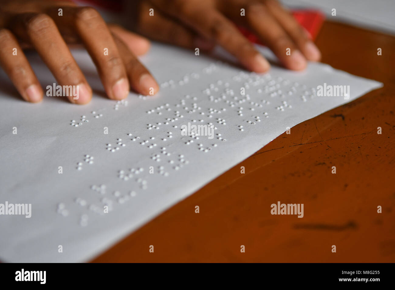 Agartala, India. 14th Mar, 2018. Indian blind girls are writing in a ...