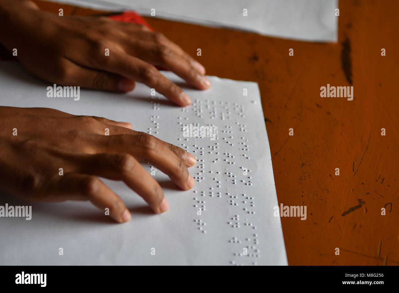 Agartala, India. 14th Mar, 2018. Indian blind girls are writing in a ...
