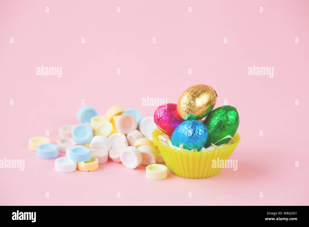 Easter Eggs Chocolates mini basket closeup with drops Stock Photo - Alamy