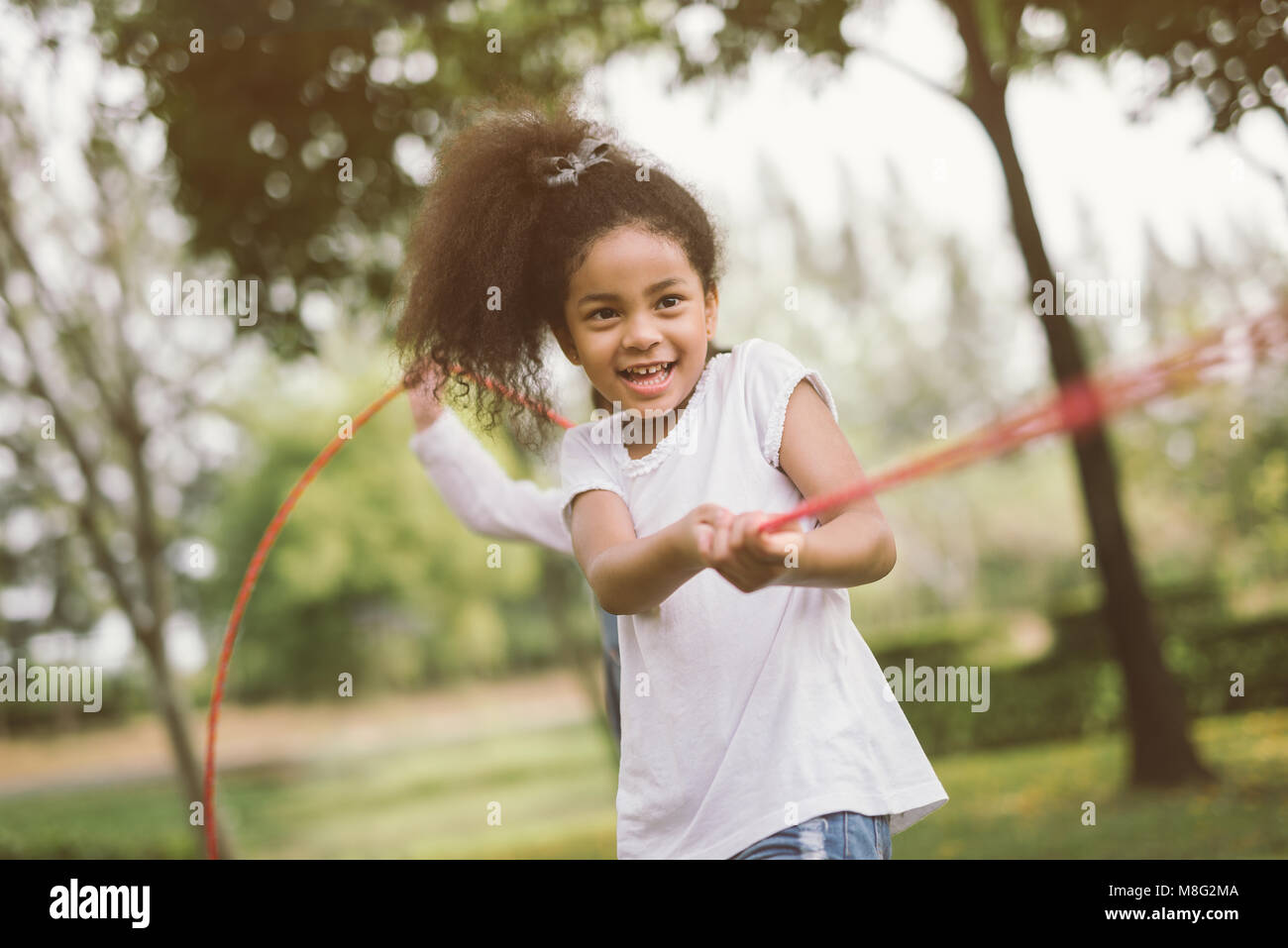 Children playing tug of war hi-res stock photography and images - Alamy