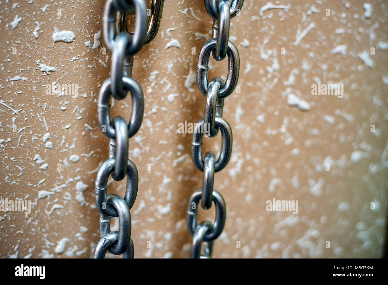 Close up old metal chain on wall Stock Photo - Alamy