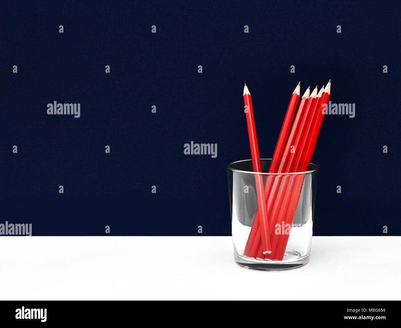 Red pencils photo mockup Set of identical red pencils are standing in ...