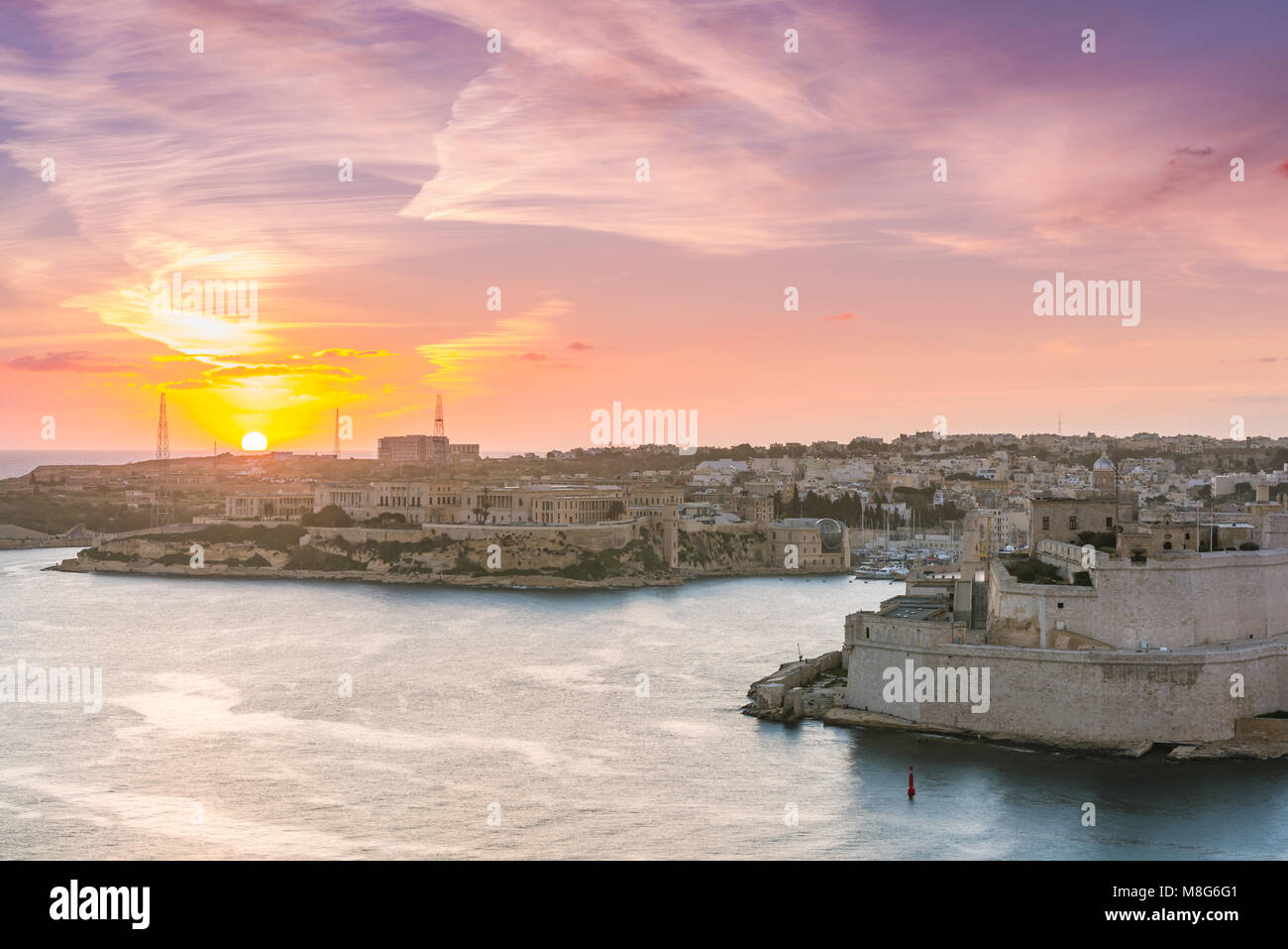 Beautiful sunrise over Three Cities in Malta Stock Photo - Alamy