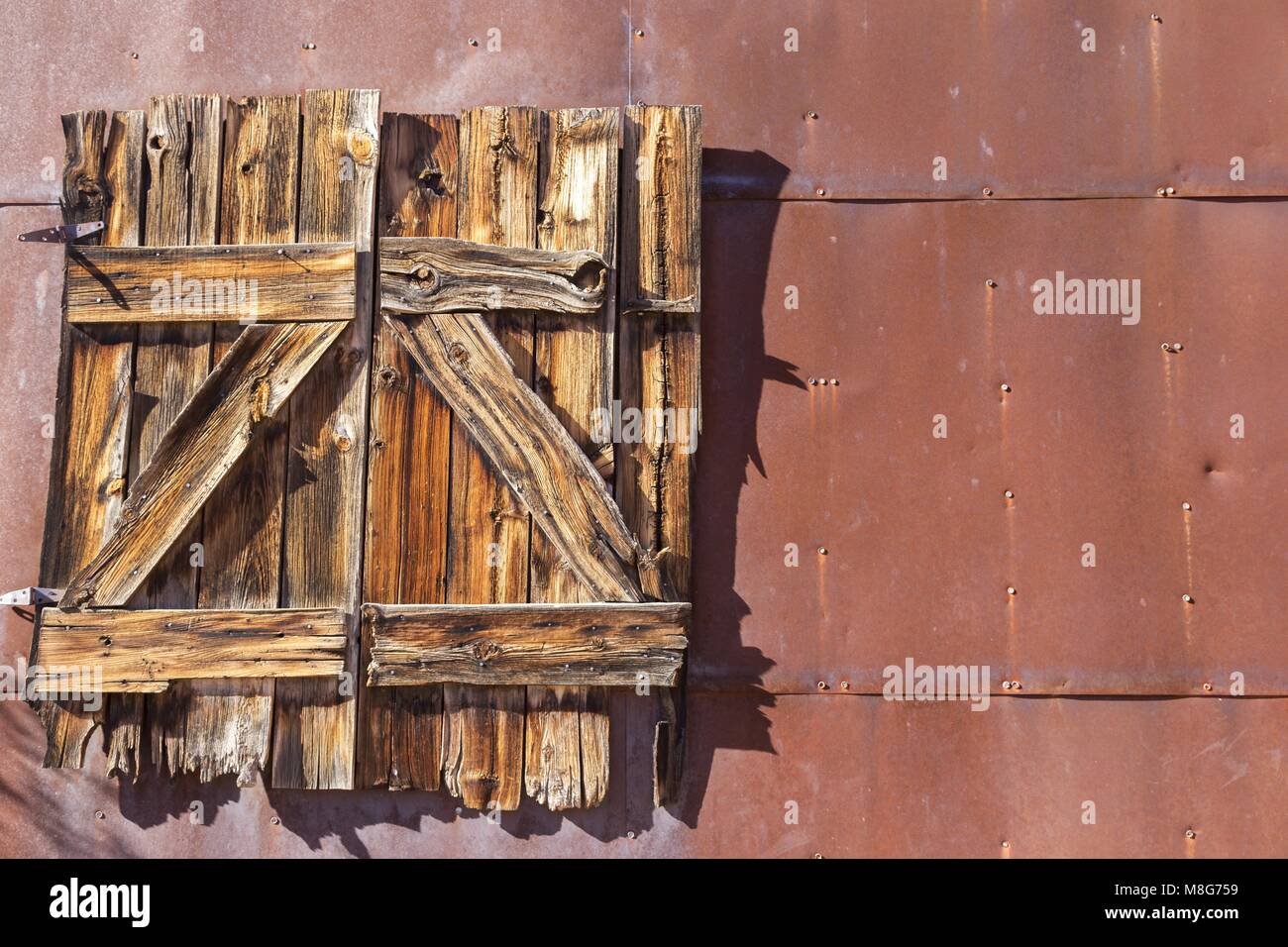 Old Wood Window Closed on Rust Colored Old Metal Wall of Abandoned ...