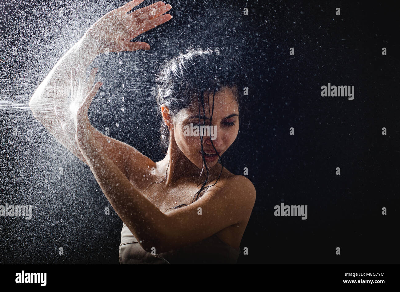 young girl portrait and splashing water in her face. beautiful female ...