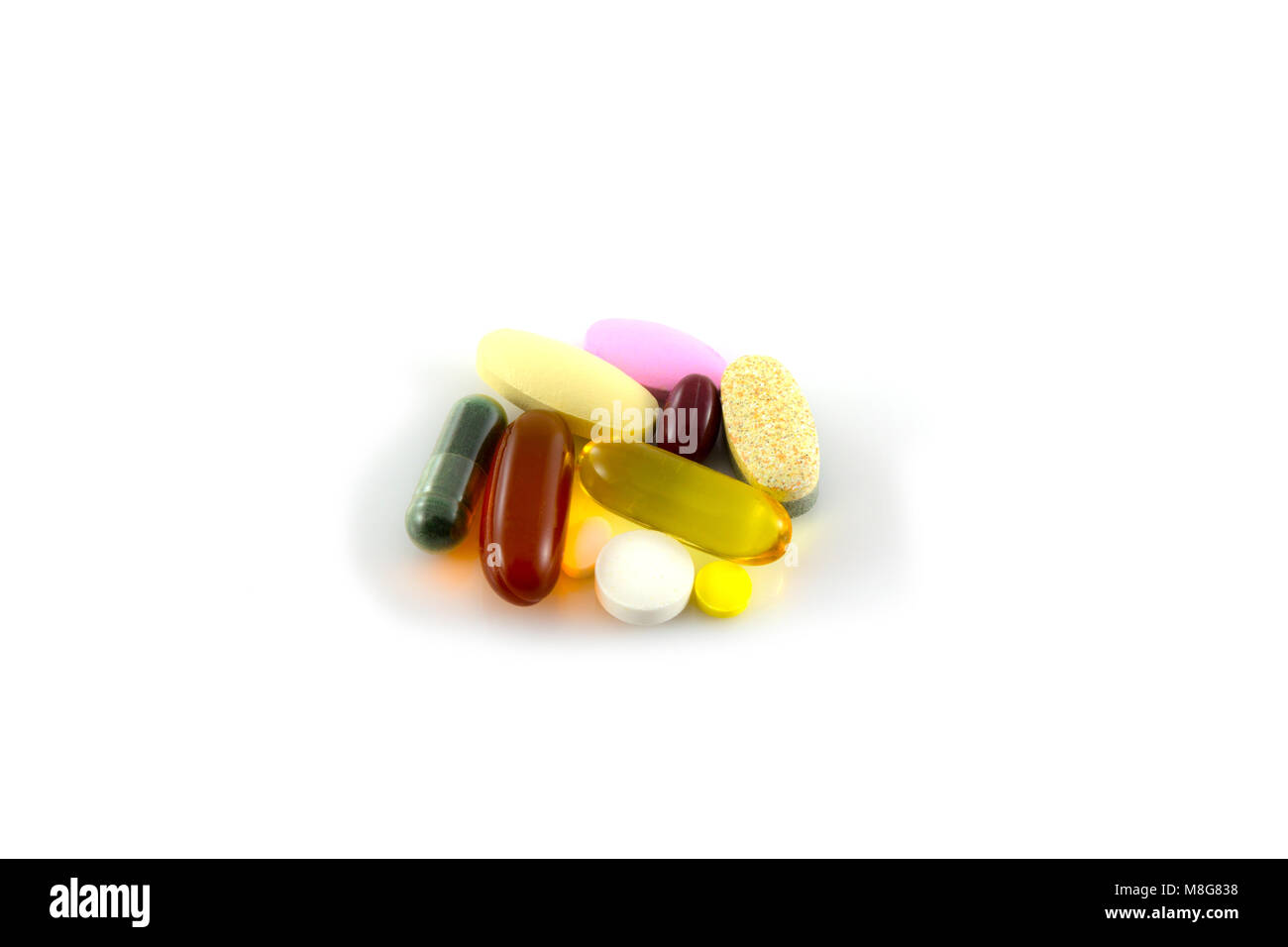 healthcare, various colours pharmacy pills and capsules isolated over ...
