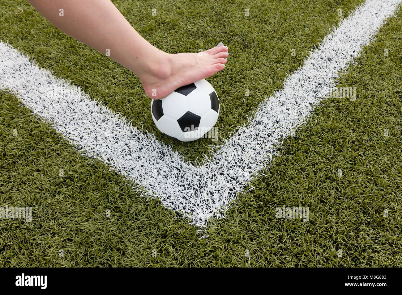 girl foot on the soccer ball on green field morning Stock Photo - Alamy