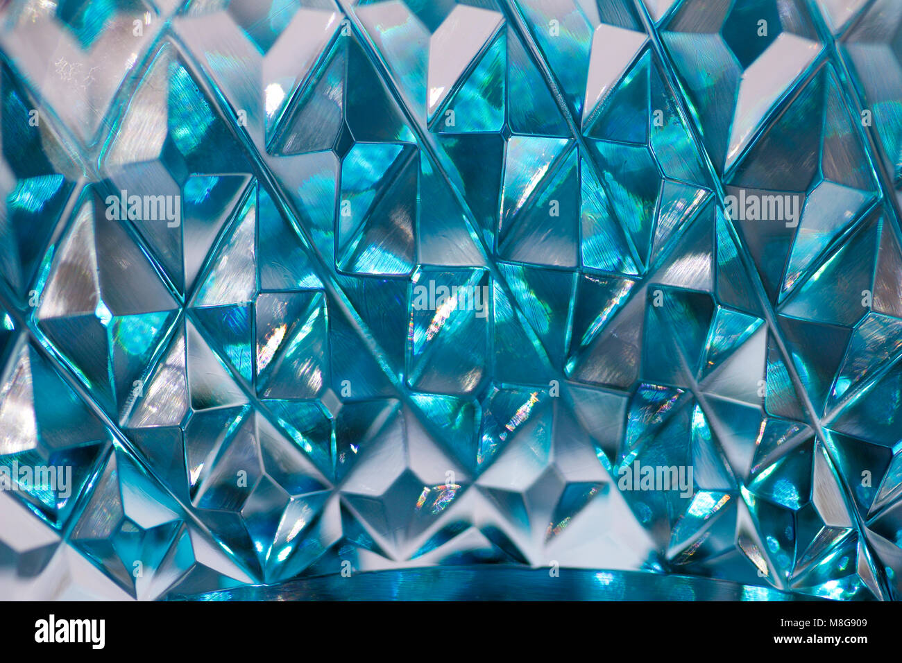 Macro abstract of brilliant lead crystal diamond cut facets in bright ...