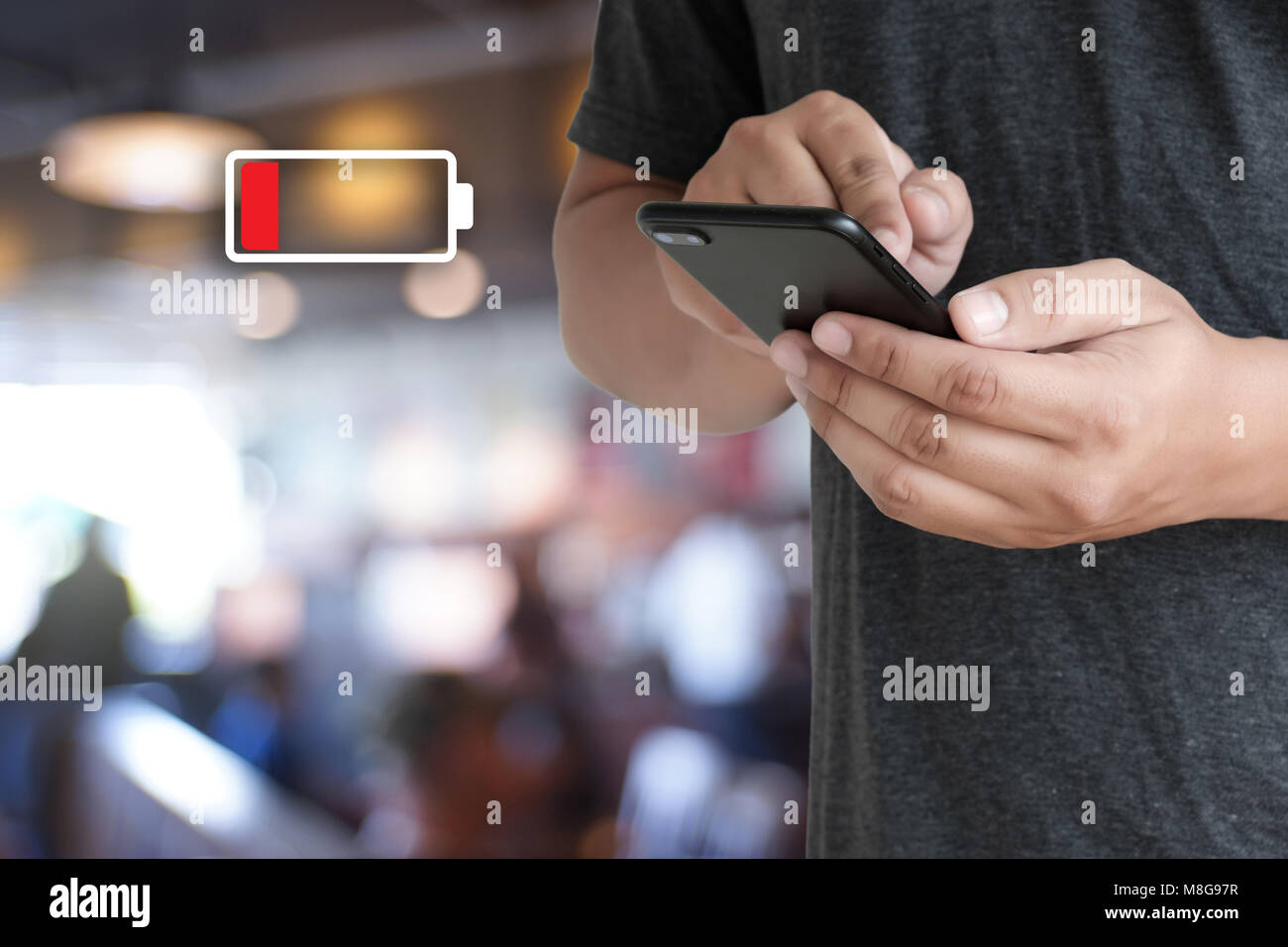 Close up man hands using smart phone battery low charged battery screen ...