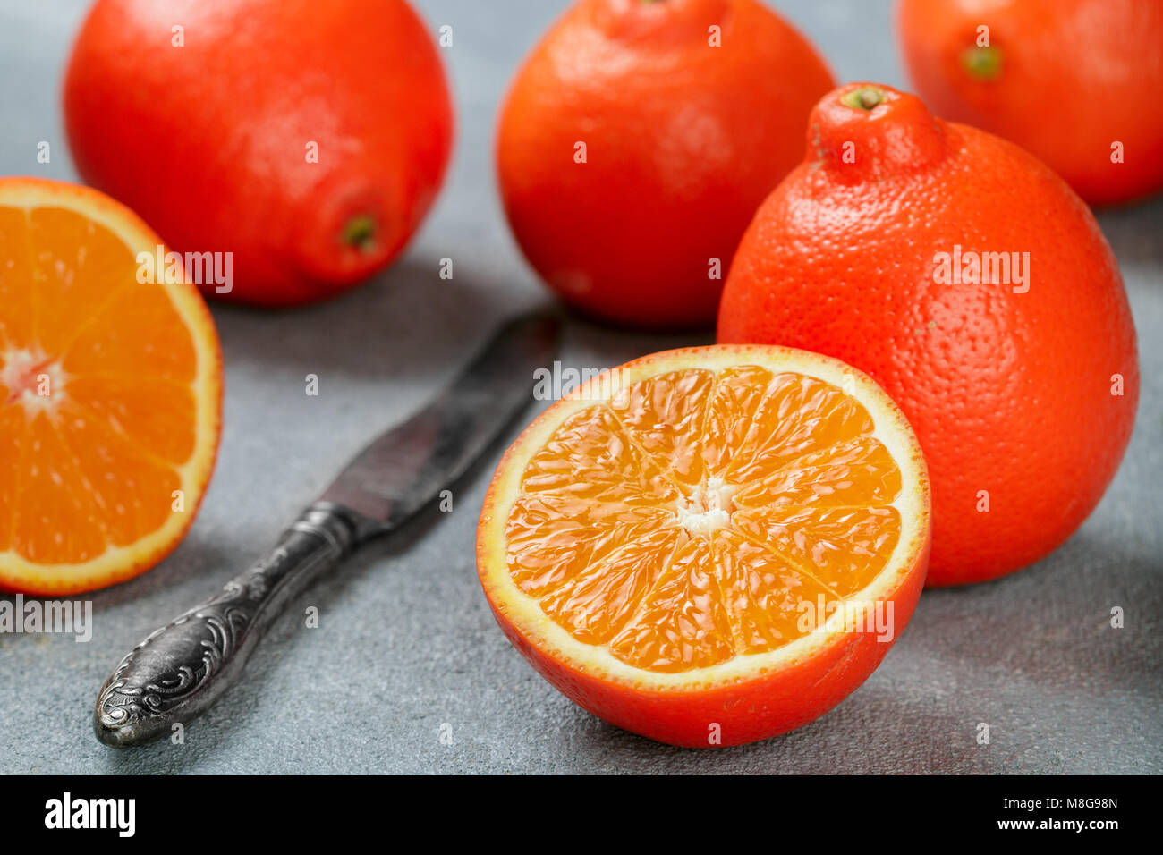 Mineola. Tangerine. Juicy sweet orange citrus fruit whole and sliced on ...