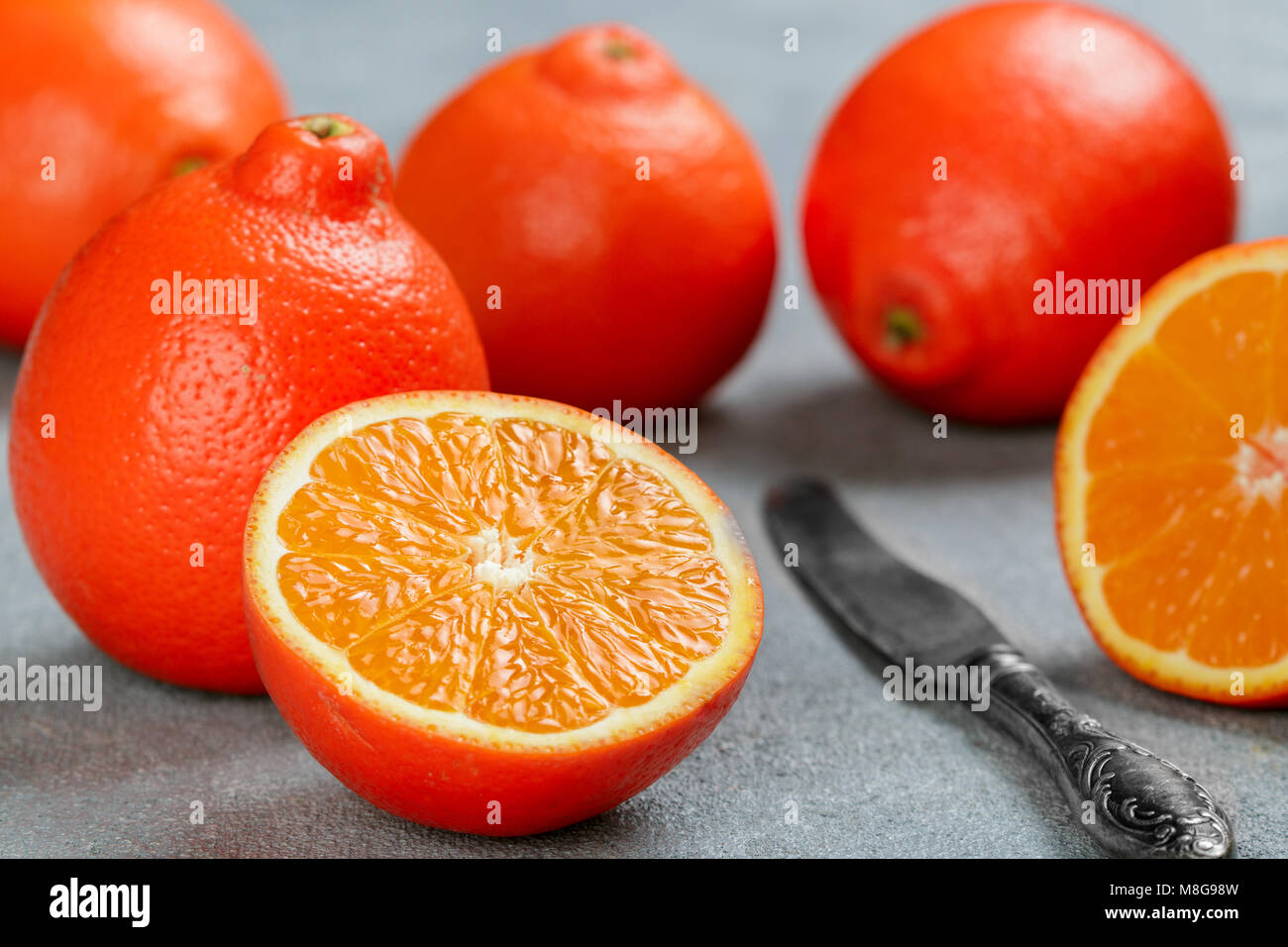 Mineola. Tangerine. Juicy sweet orange citrus fruit whole and sliced on ...