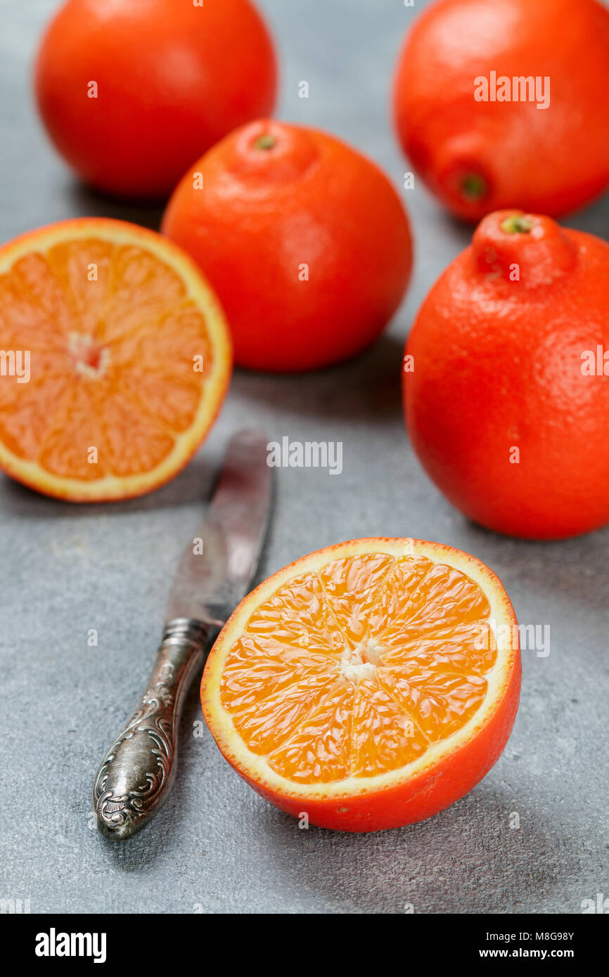 Mineola. Tangerine. Juicy sweet orange citrus fruit whole and sliced on ...