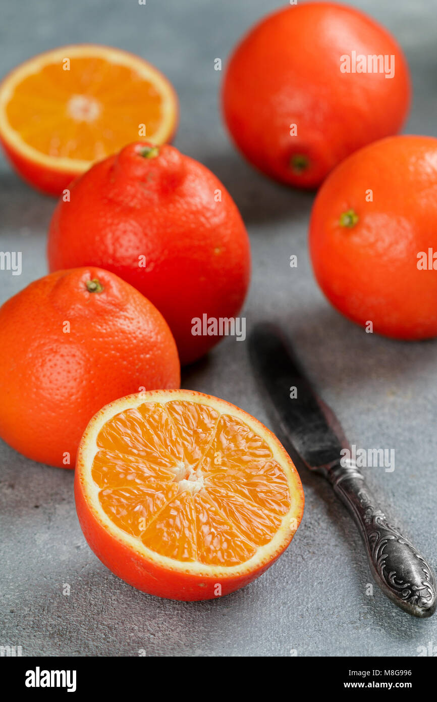 Mineola. Tangerine. Juicy sweet orange citrus fruit whole and sliced on ...