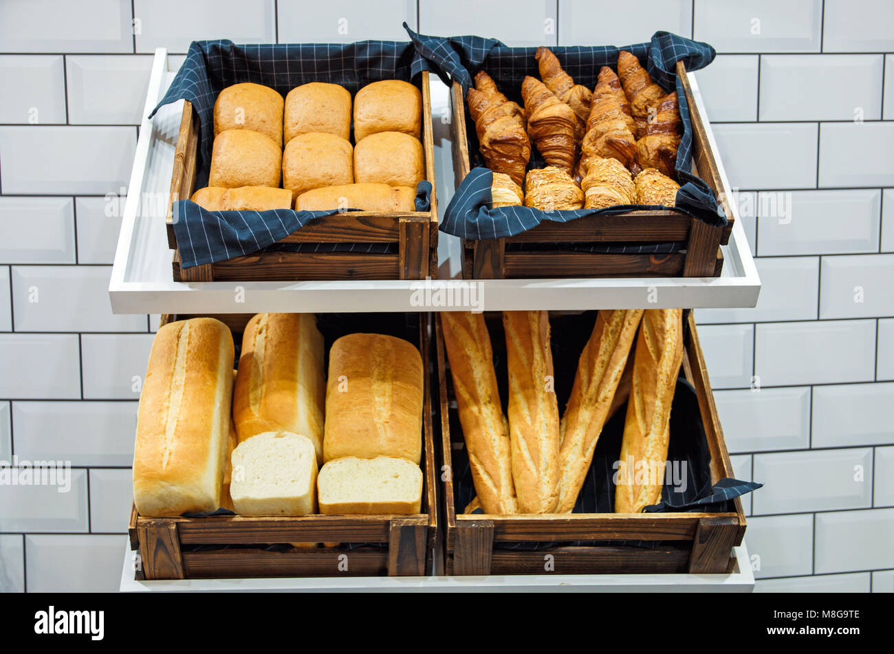 different fresh bread on the shelves in bakery Stock Photo - Alamy
