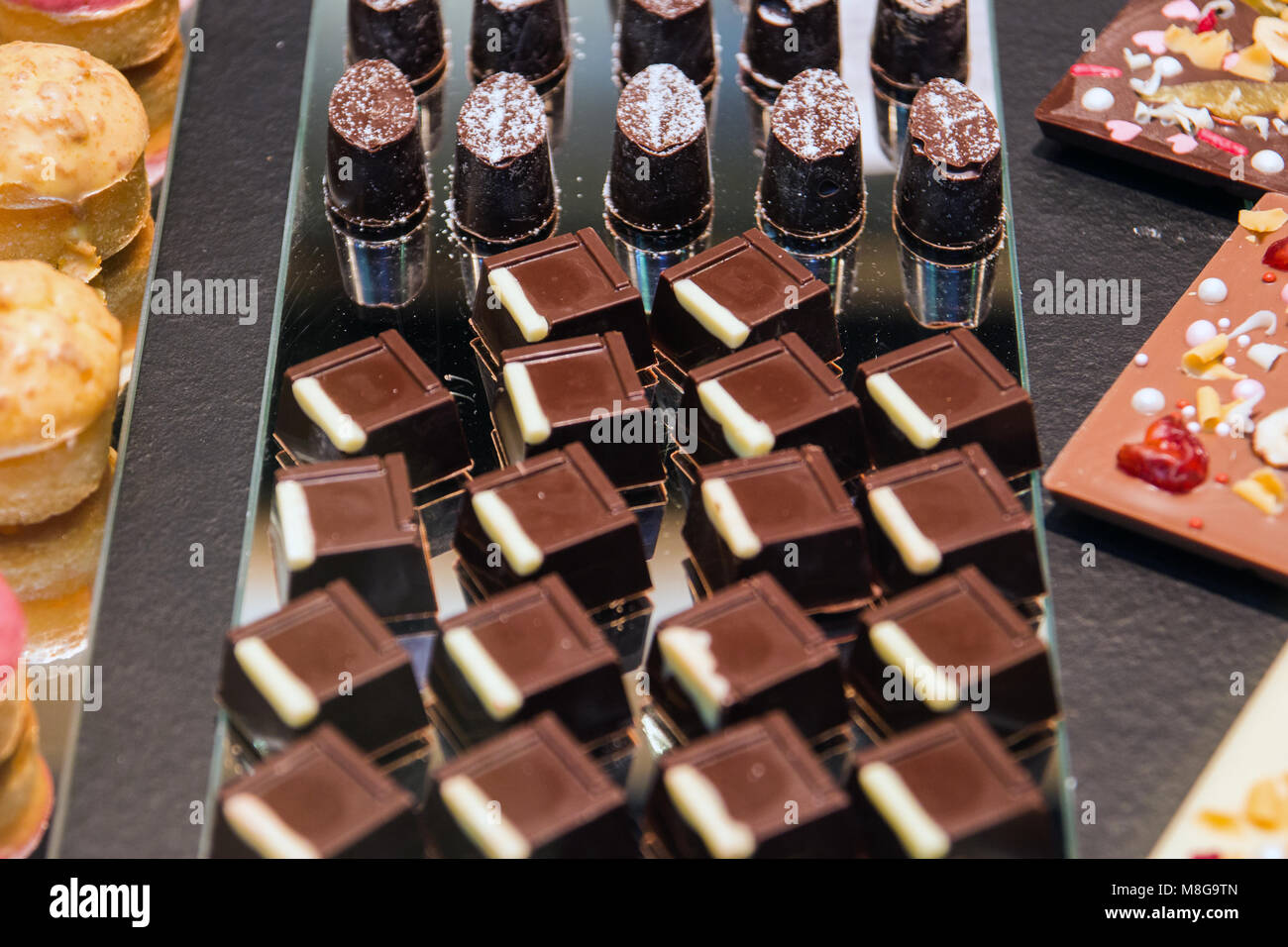 chocolate candy with filling, nuts and fruits Stock Photo - Alamy
