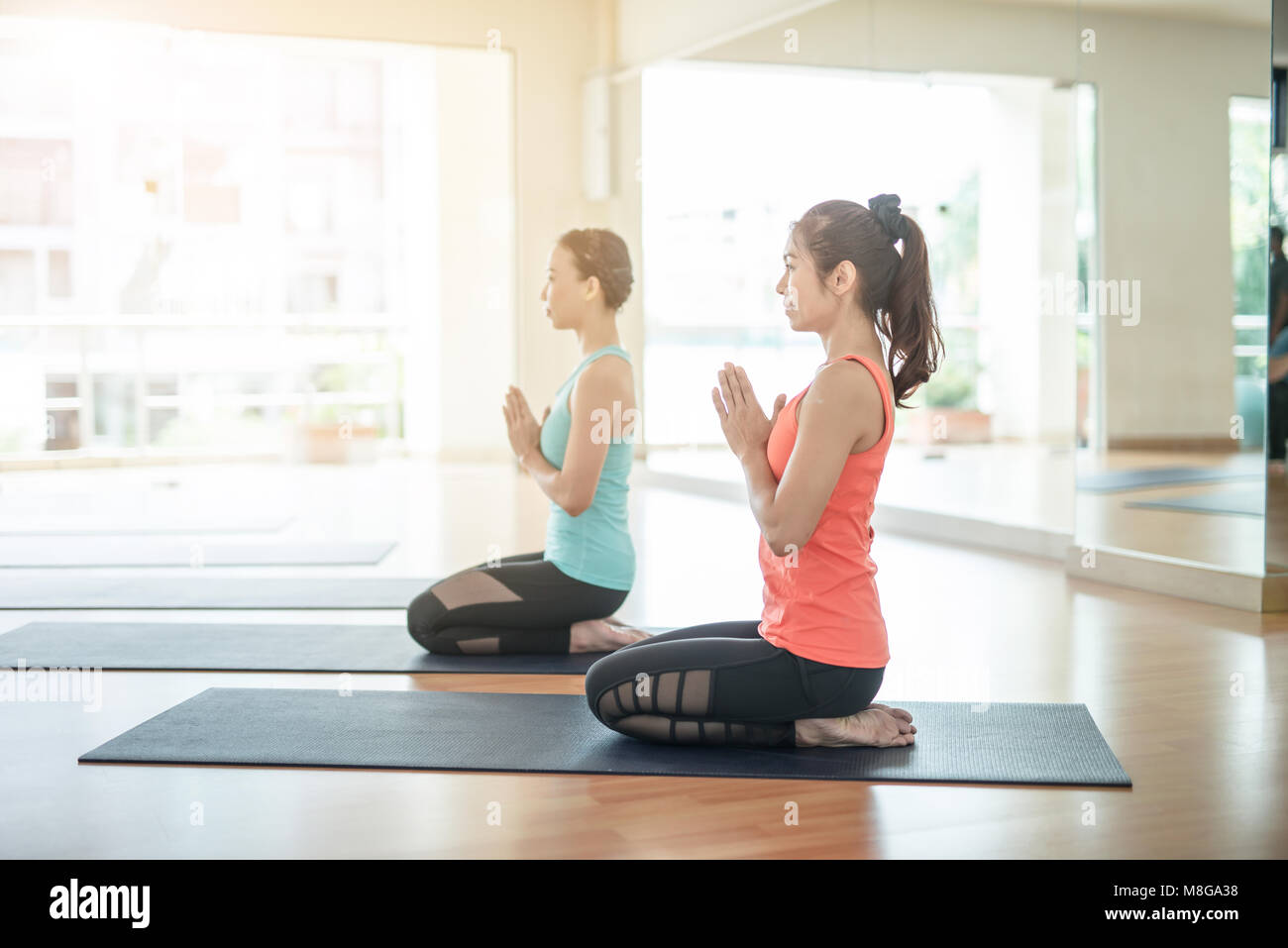 fitness, sport, training, yoga and people concept - Asian woman do ...