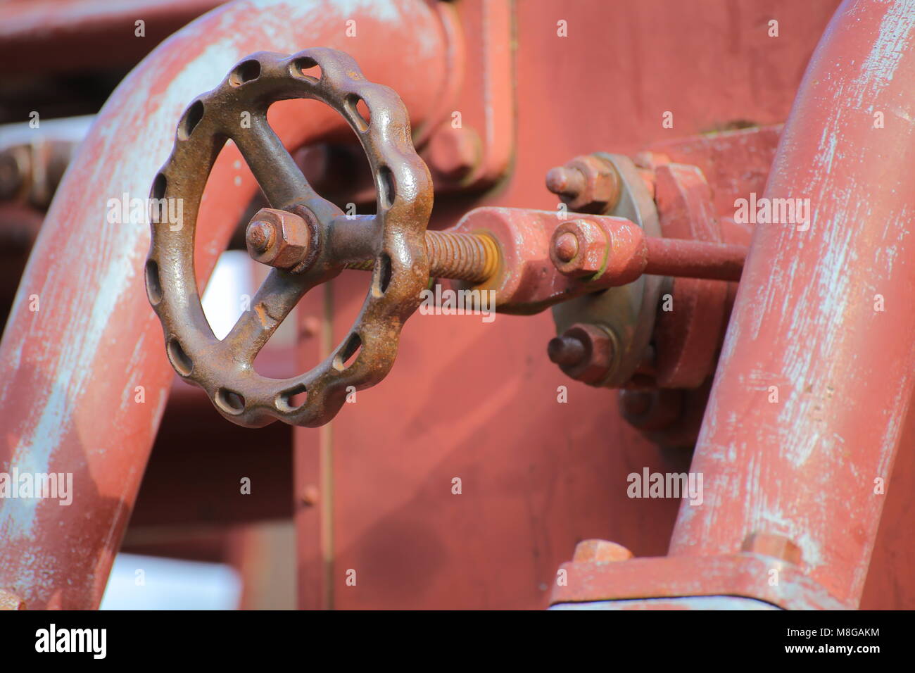 Valve of a historical red steam engine Stock Photo - Alamy
